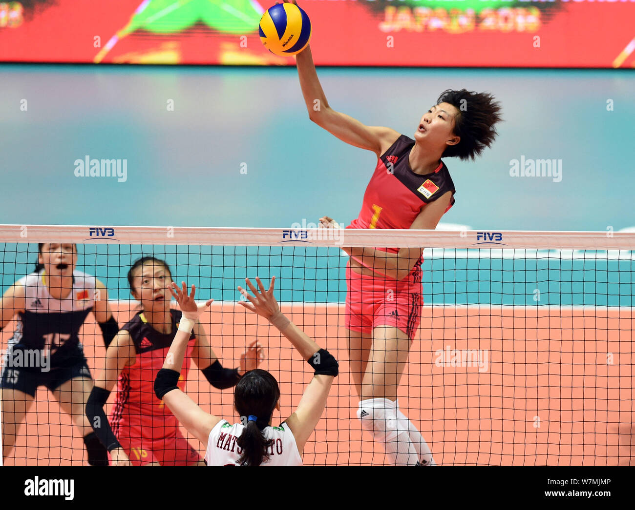 Yuan Xinyue, right, of China spikes against Ayaka Matsumoto of Japan ...