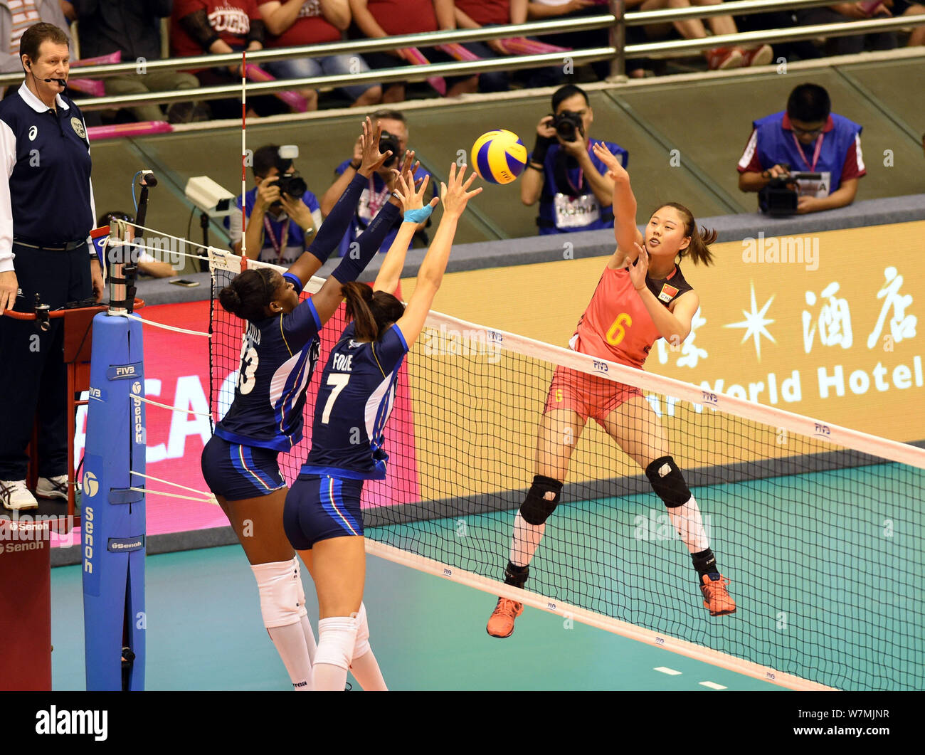 Gong Xiangyu, right, of China, spikes against Miryam Fatime Sylla and ...