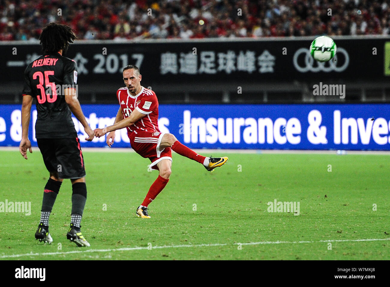 French football player Franck Ribery, right, of Bayern Munich kicks the ...