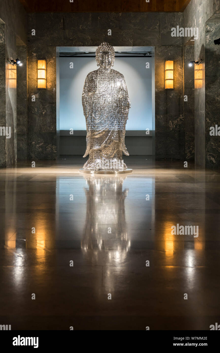 An artwork in the form of a Buddharupa named "Wenyu" is on display at ...