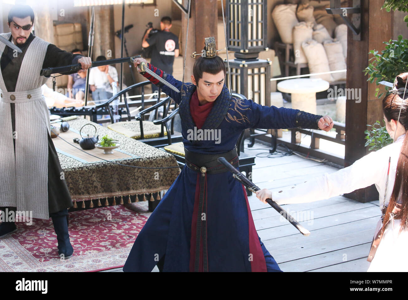 Taiwanese actor Chen Bolin is pictured during a filming session on set ...