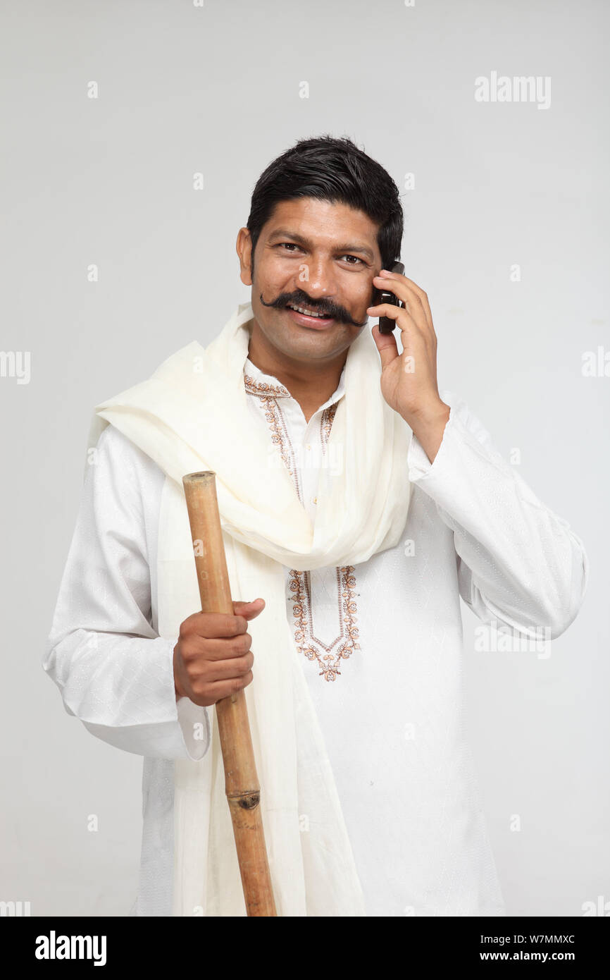 Indian farmer talking on mobile hi-res stock photography and images - Alamy