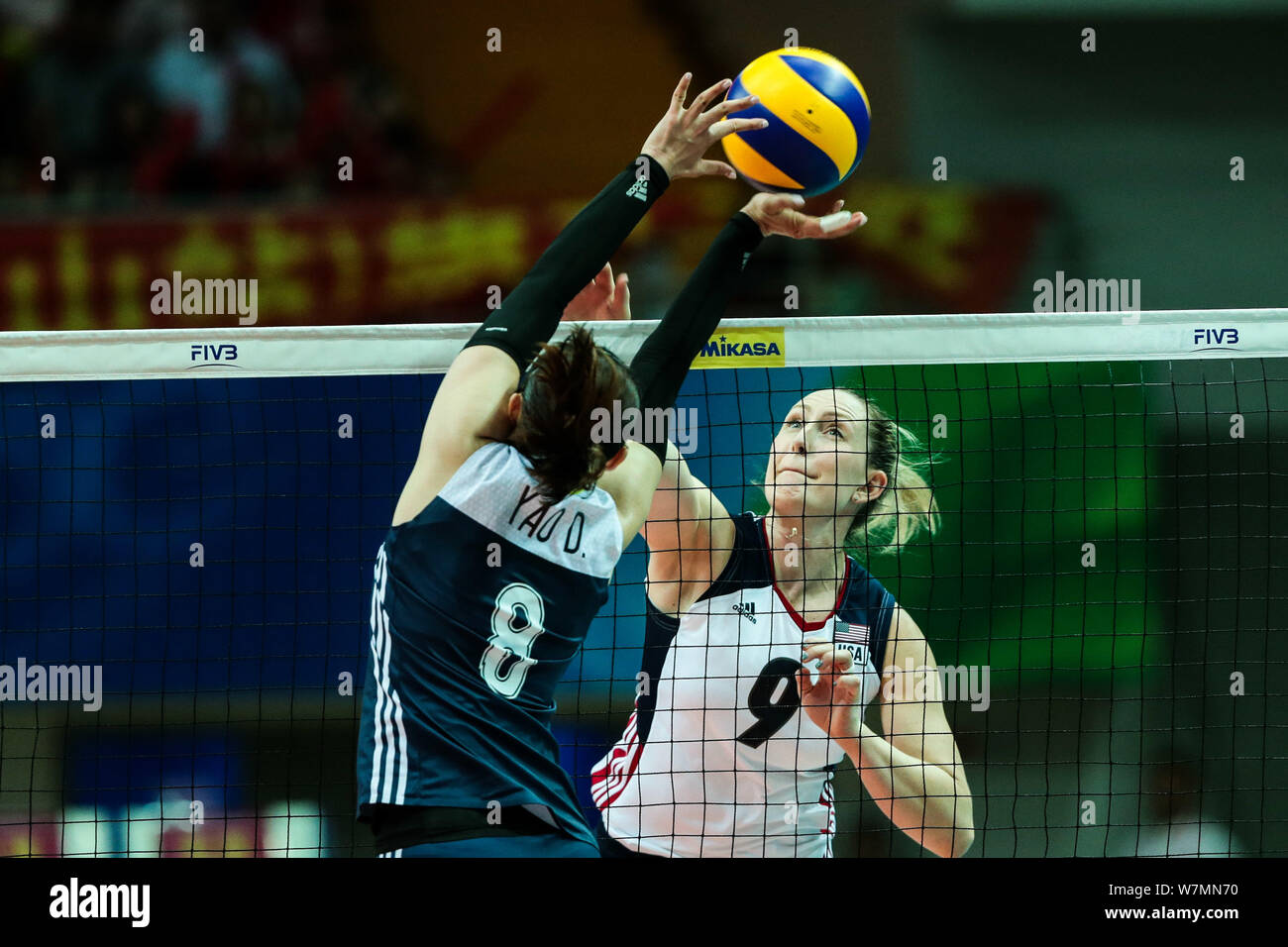 Yao Di of China, front, tries to block a spike against Madison Kingdon ...