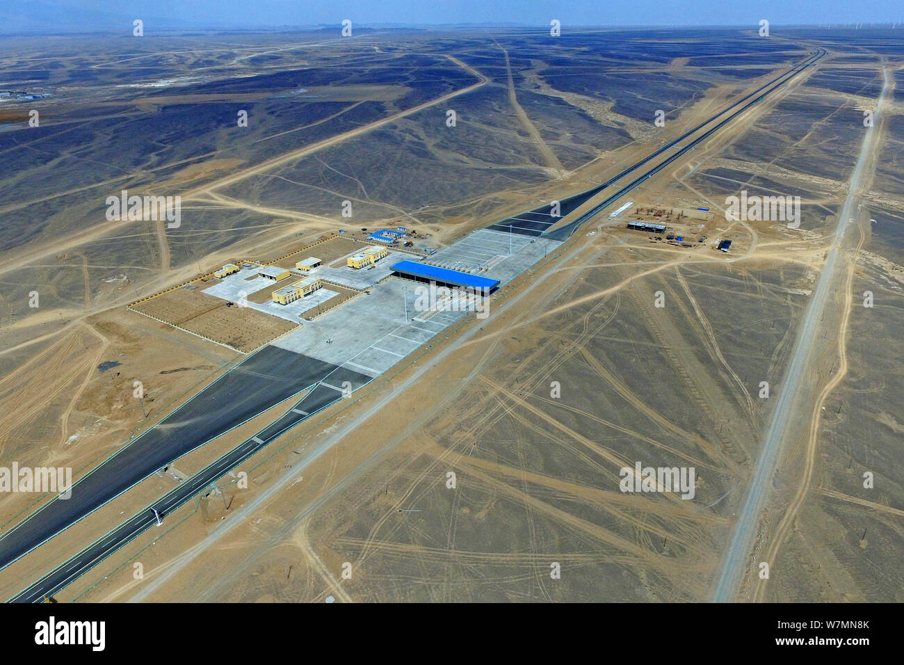 Aerial view of the Beijing-Urumqi Expressway through the Gobi desert ...