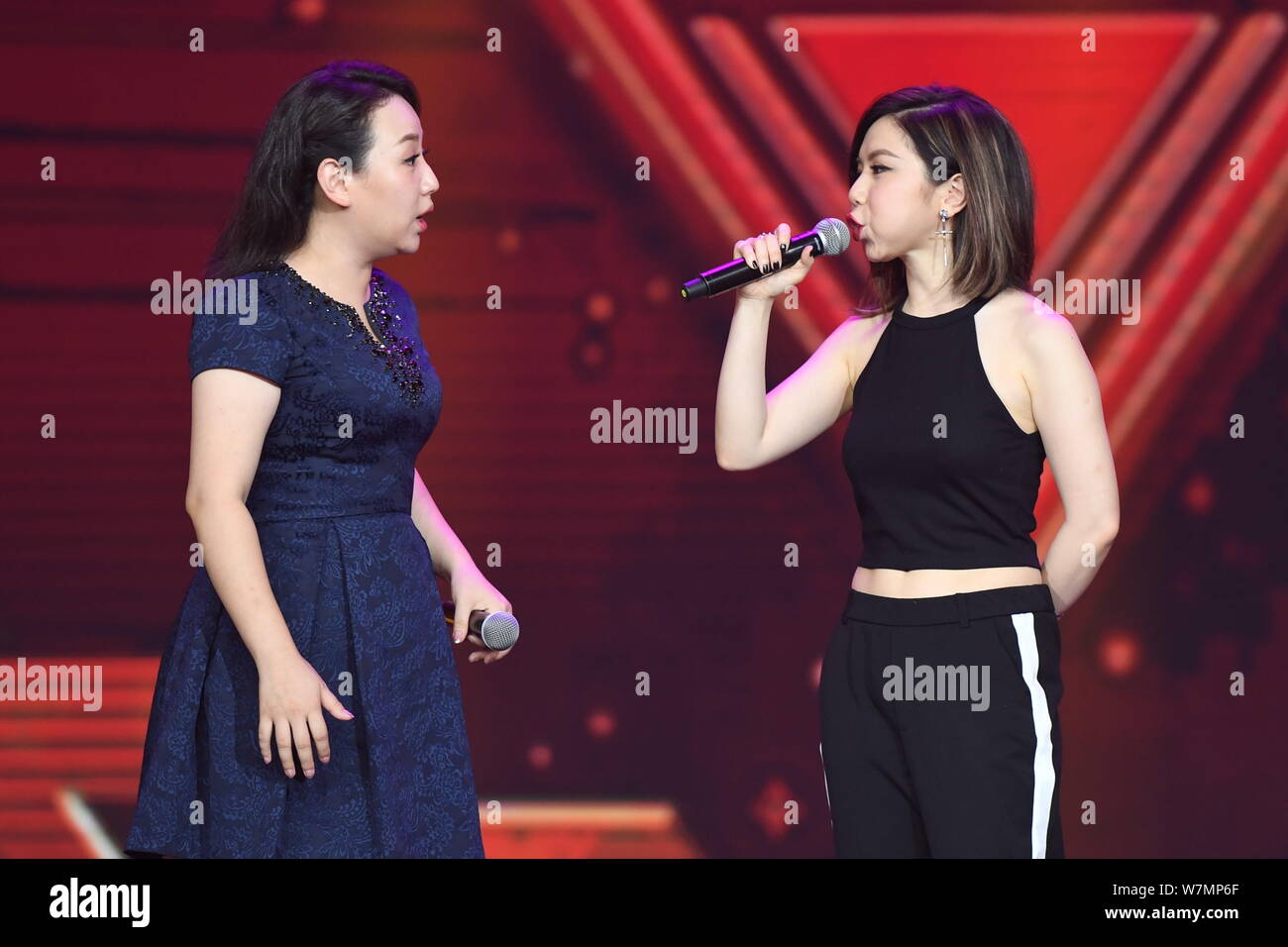 Hong Kong singer Gloria Tang Tsz-kei, right, better known by her stage ...