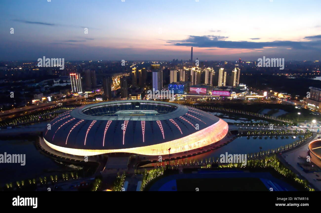 Aerial view of the Tianjin Olympic Center Stadium at night in Tianjin ...
