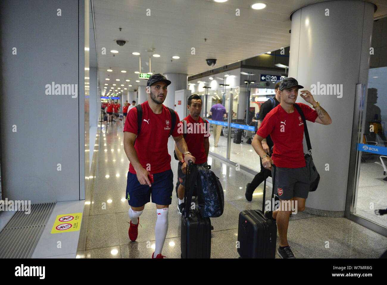 Players and coaching staff of Arsenal F.C. are pictured after arriving ...