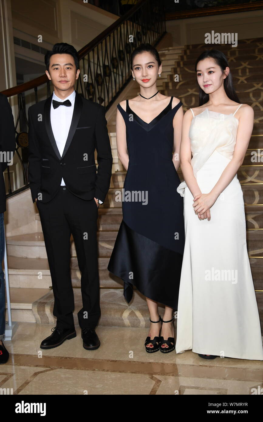 Hong Kong actress Angelababy, center, Chinese actor Huang Xuan, left ...