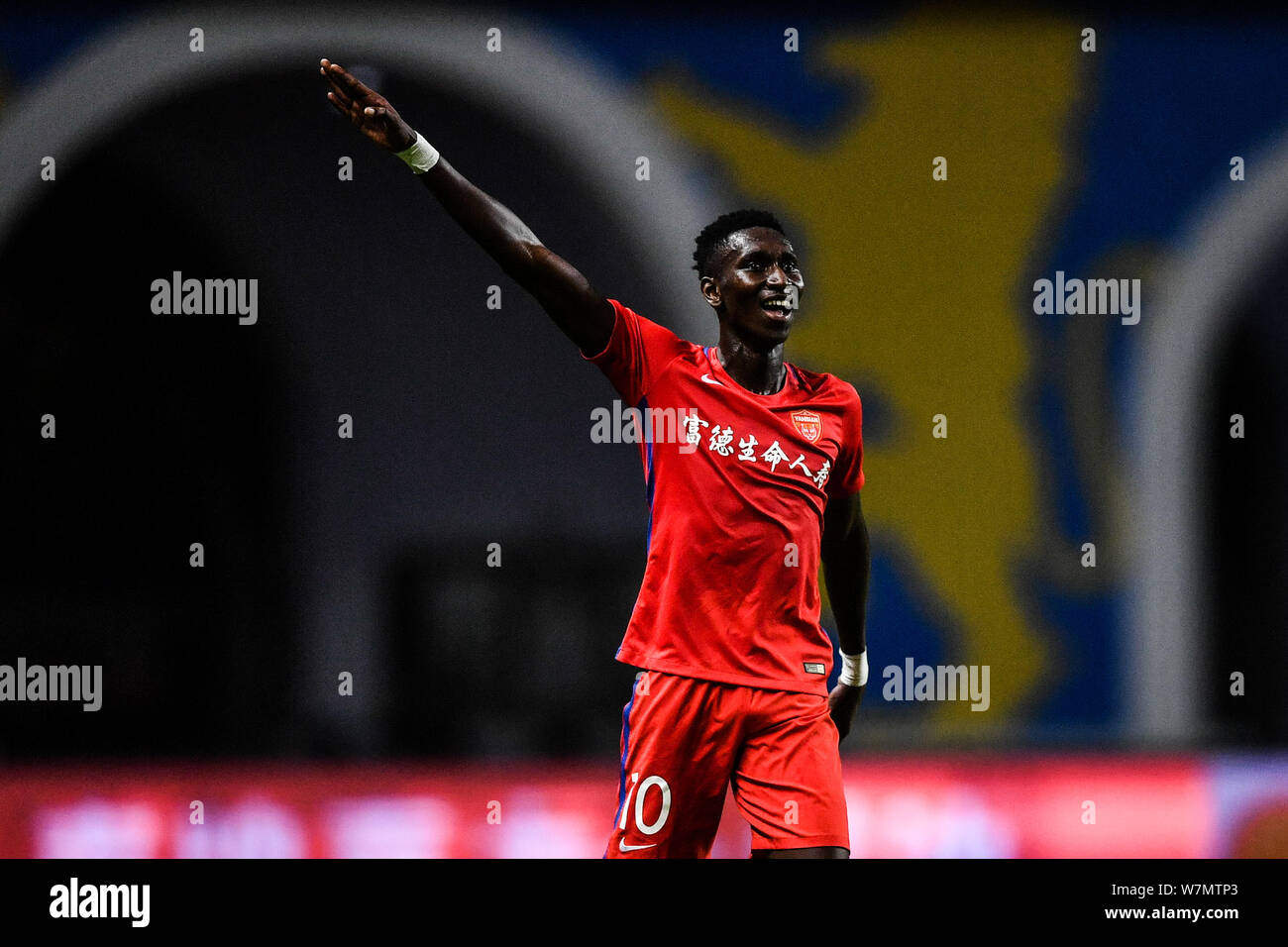 Gambian football player Bubacarr Trawally of Yanbian Funde celebrates ...