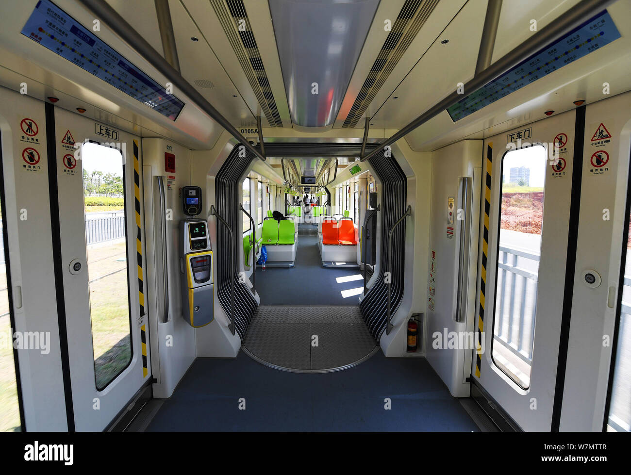 Passengers are seen in a tramcar on the city's first tram line in Wuhan ...