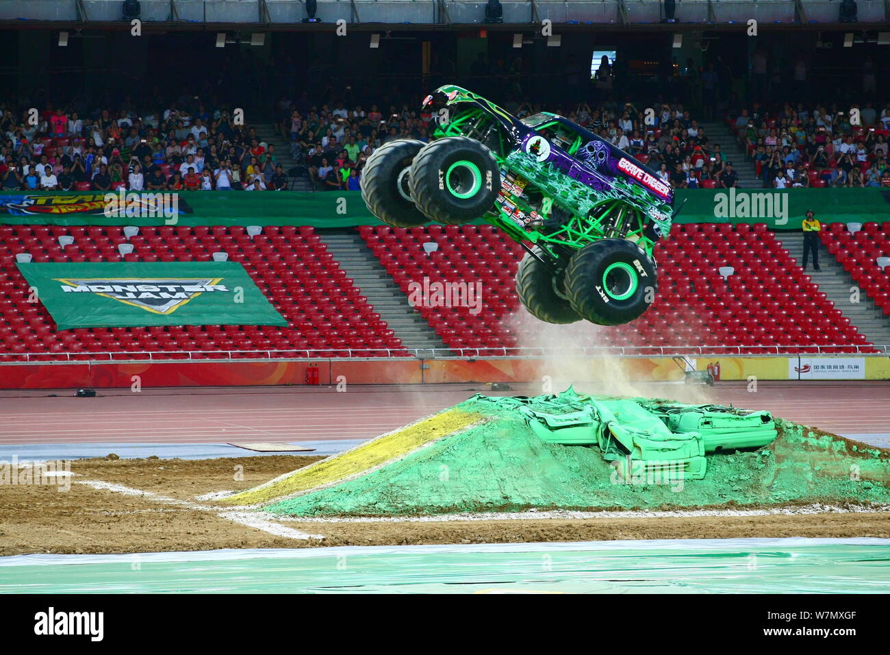 A Monster Jam truck performs wild stunts during the Monster Jam 2017 in ...