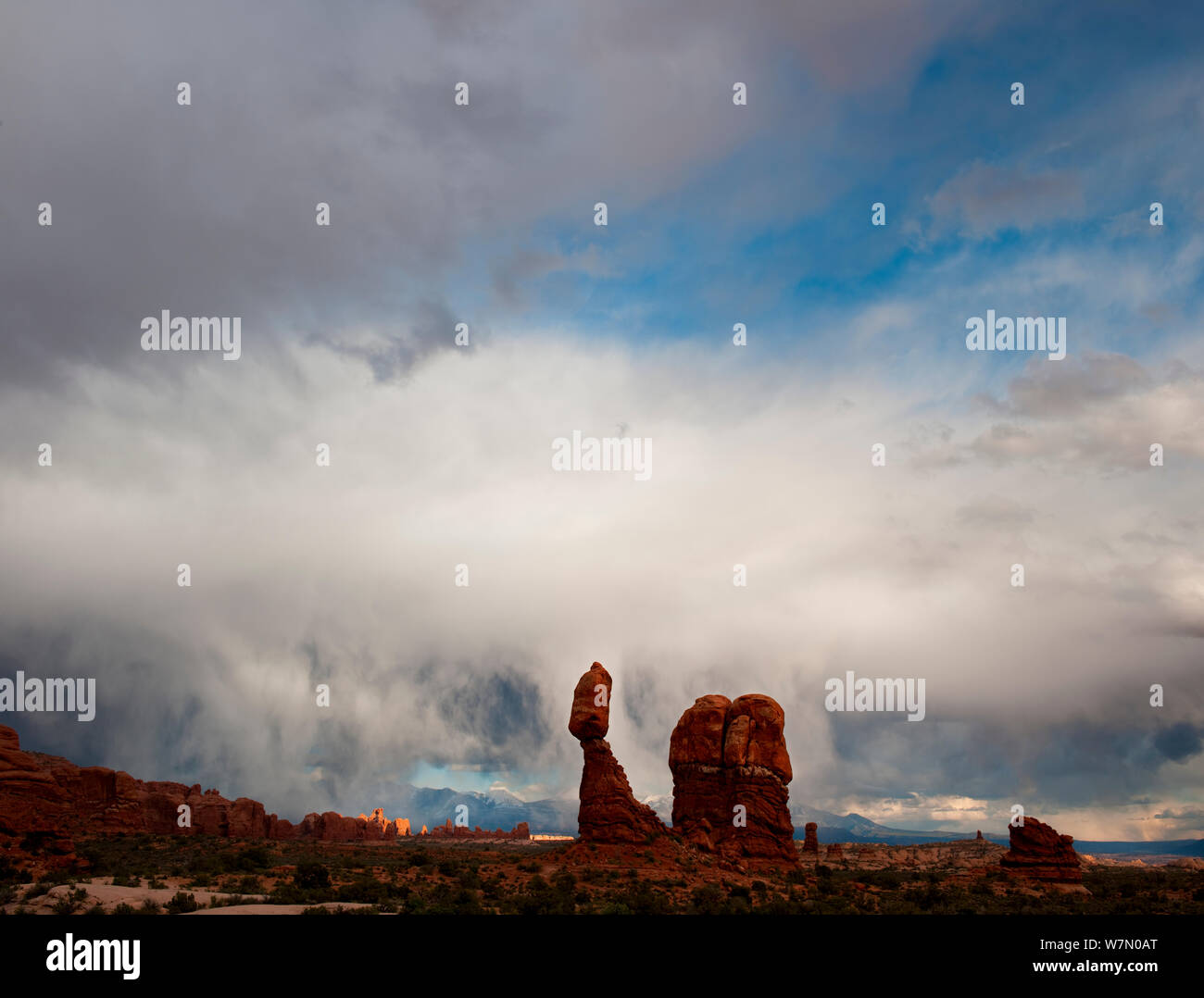 Storm clouds over Balanced Rock, Arches National Park in sunset light ...