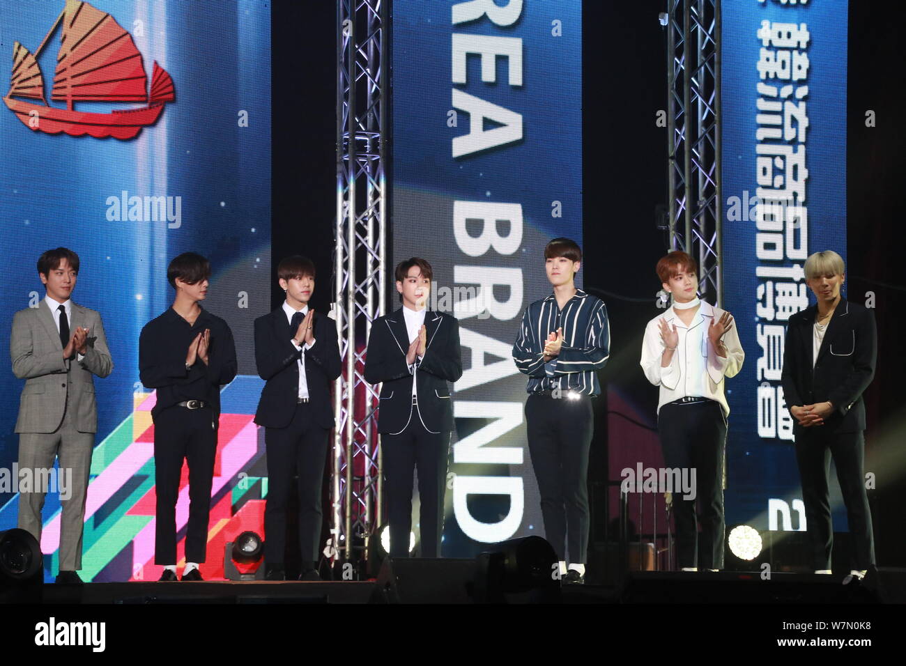 South Korean actor and singer Jung Yong-hwa, left, and members of South ...