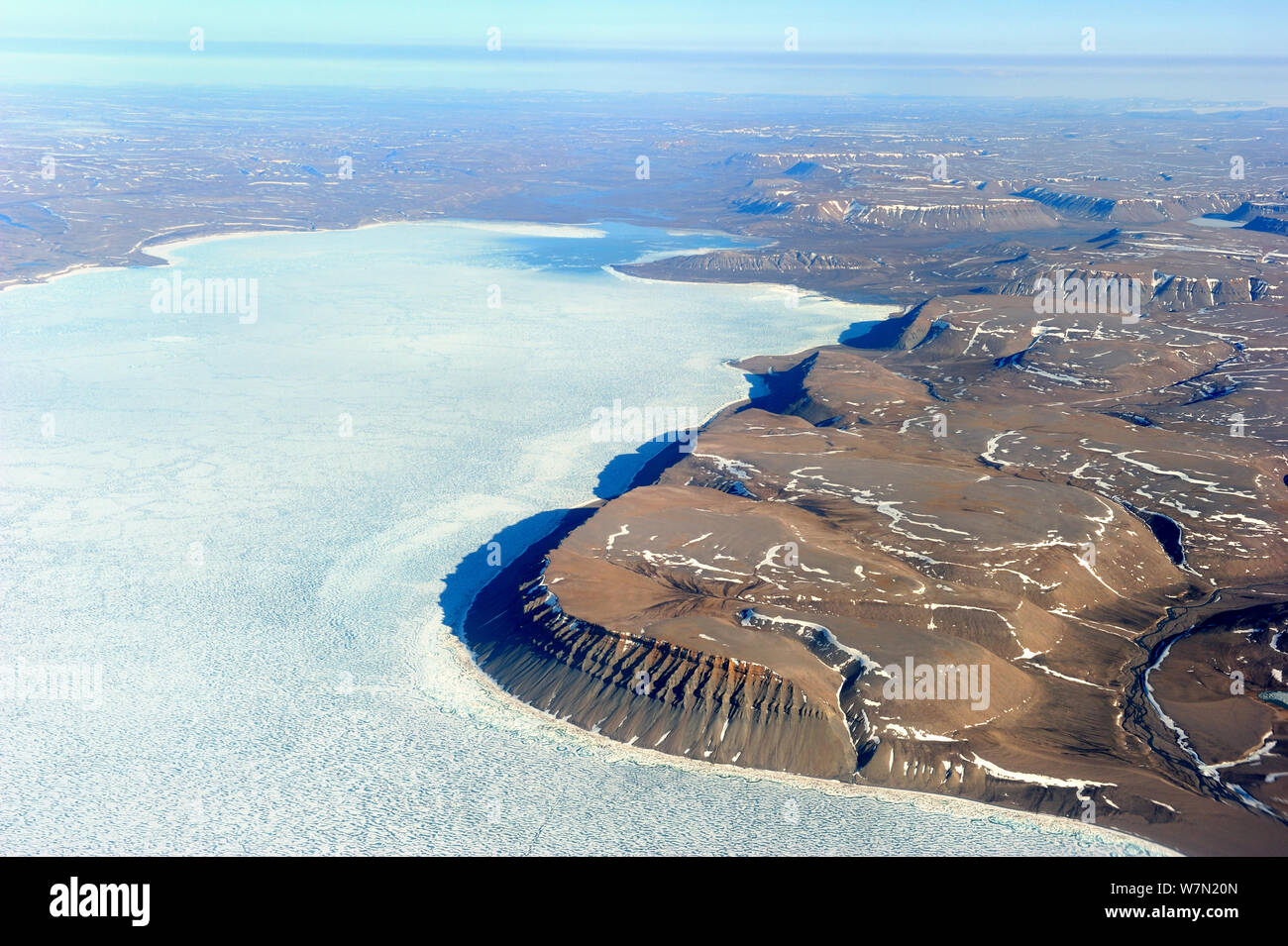 Aerial view of pack ice and cliffs, Devon Island, Nunavut, Canada, June ...