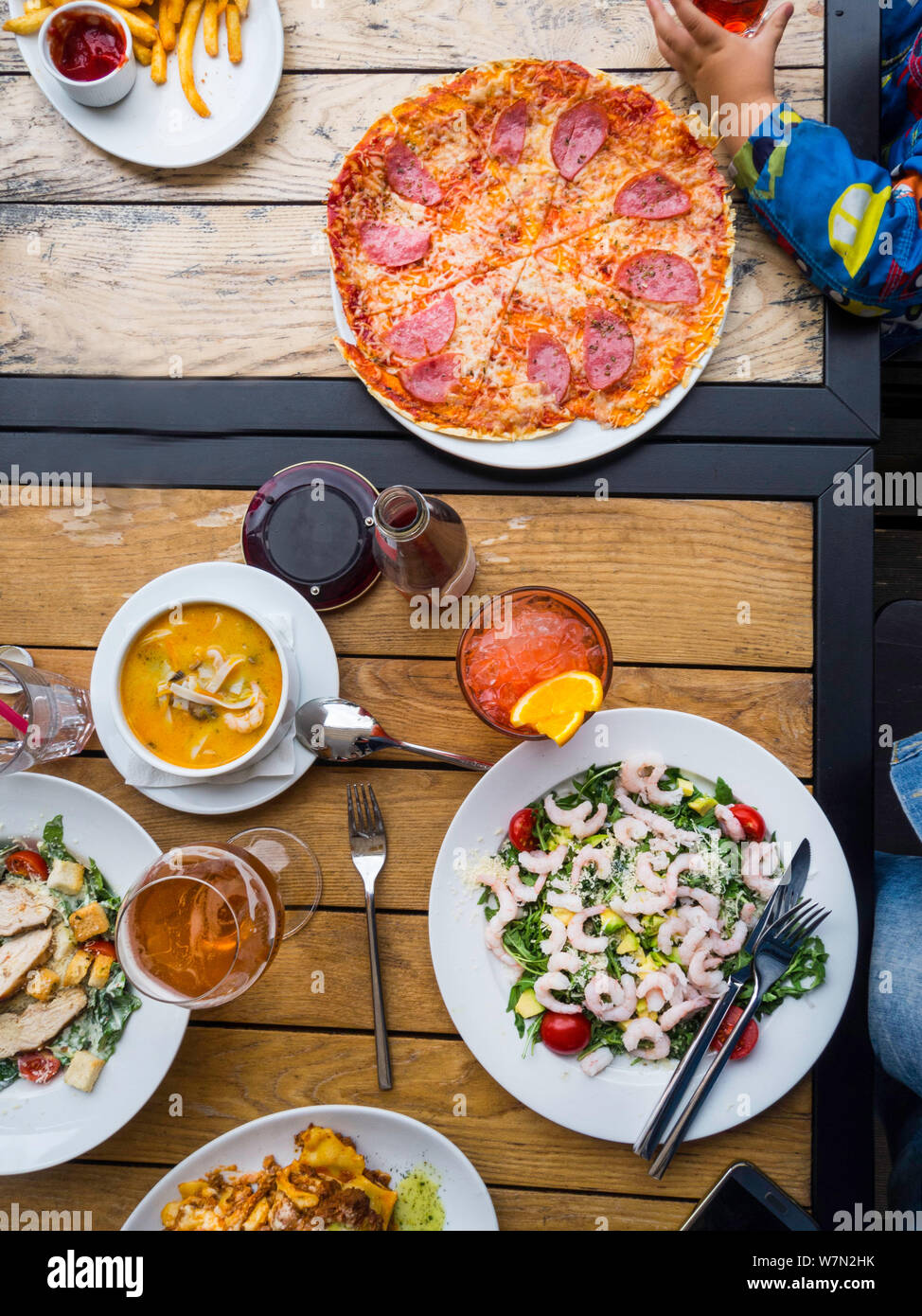 Top view family, adult and children, dinner concept, on wooden table ...