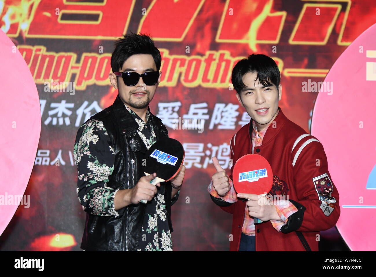 Taiwanese singer Jay Chou, left, attends a press conference to launch ...