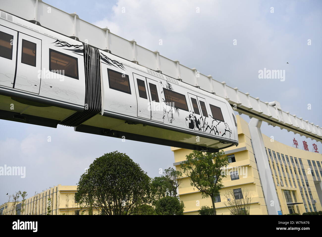 An elevated new energy monorail train travels along a 1.4km air rail at ...