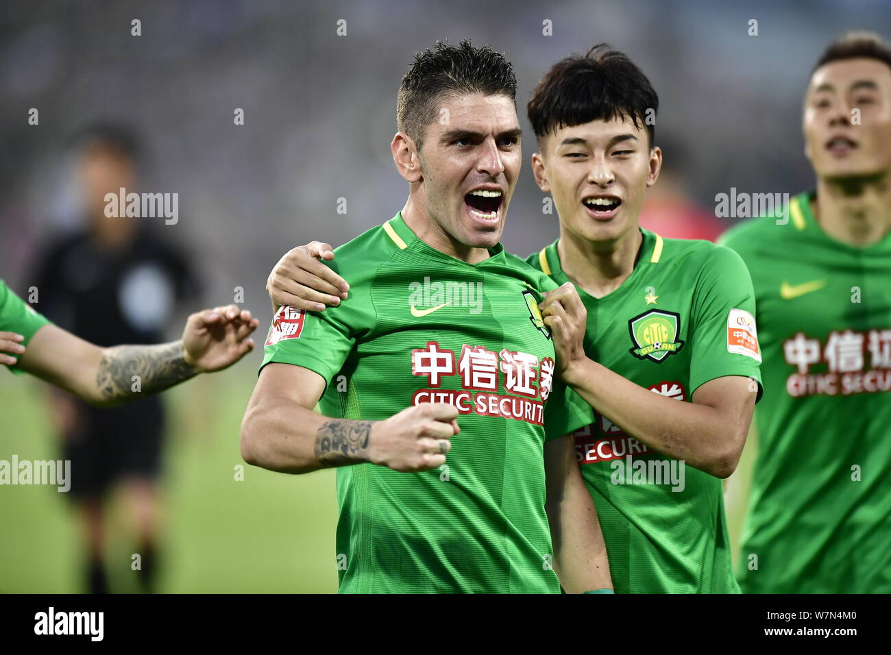 Spanish football player Jonathan Soriano, left, of Beijing Sinobo Guoan ...