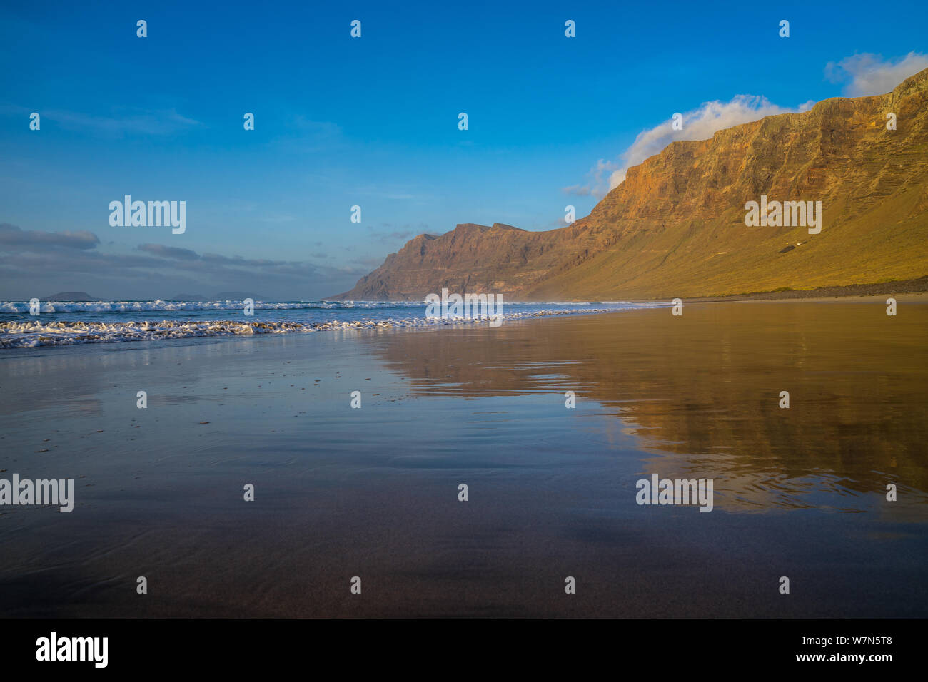 Spain, Lanzarote, Popular surfers paradise famara beach in magical warm ...