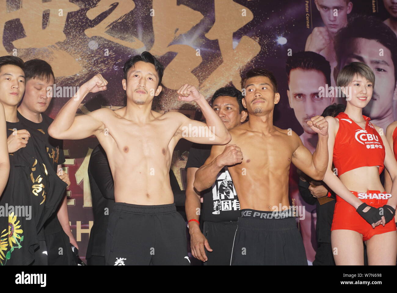 Chinese boxing star Zou Shiming, left, and Japanese boxer Sho Kimura ...