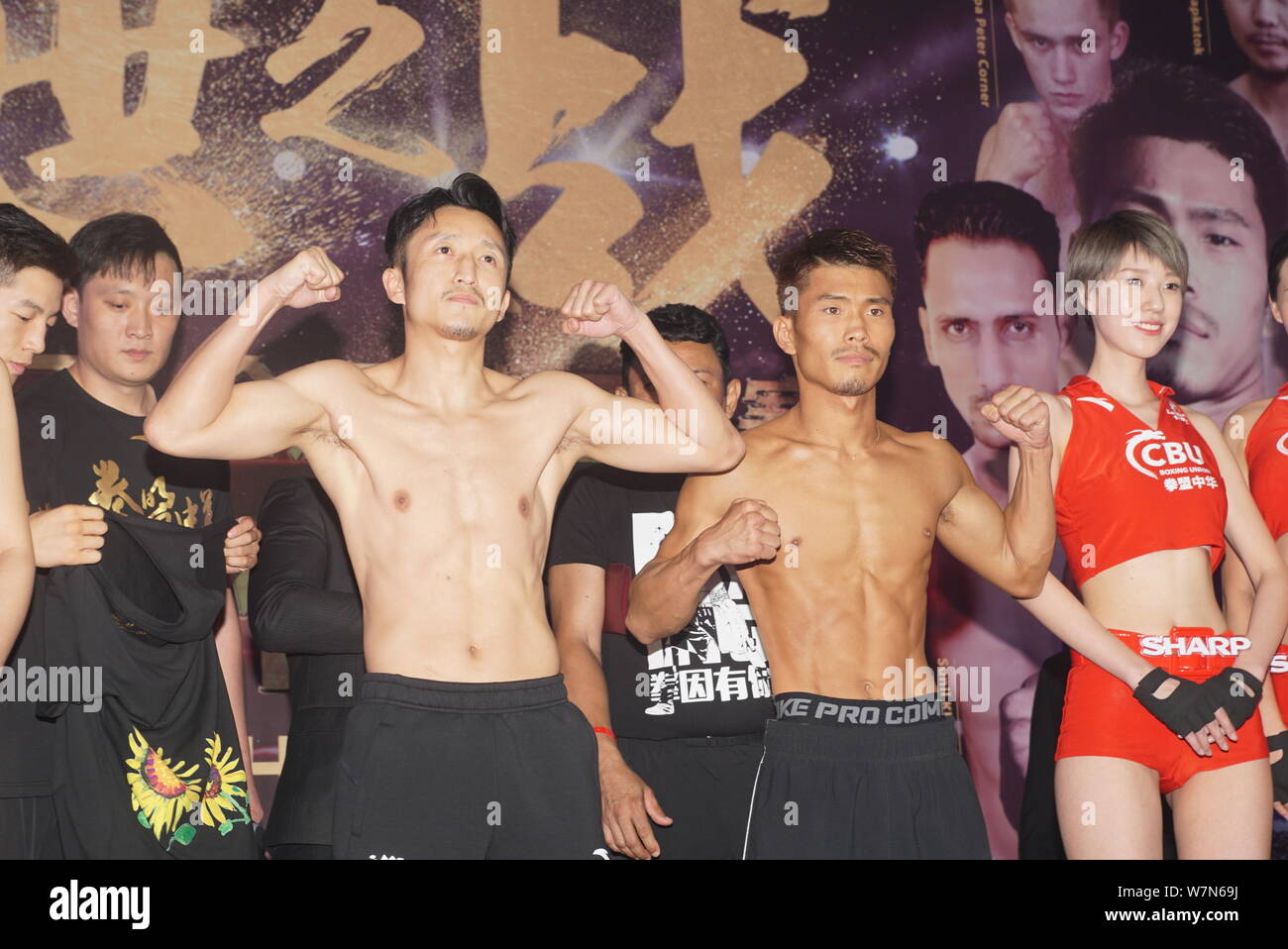 Chinese boxing star Zou Shiming, left, and Japanese boxer Sho Kimura ...