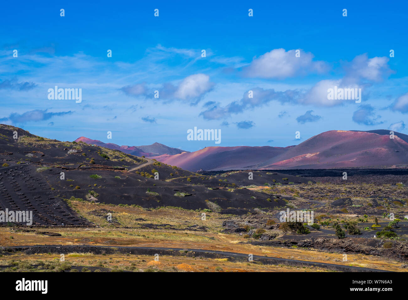 Spain, Lanzarote, Volcanic nature landscape of black and red volcano ...
