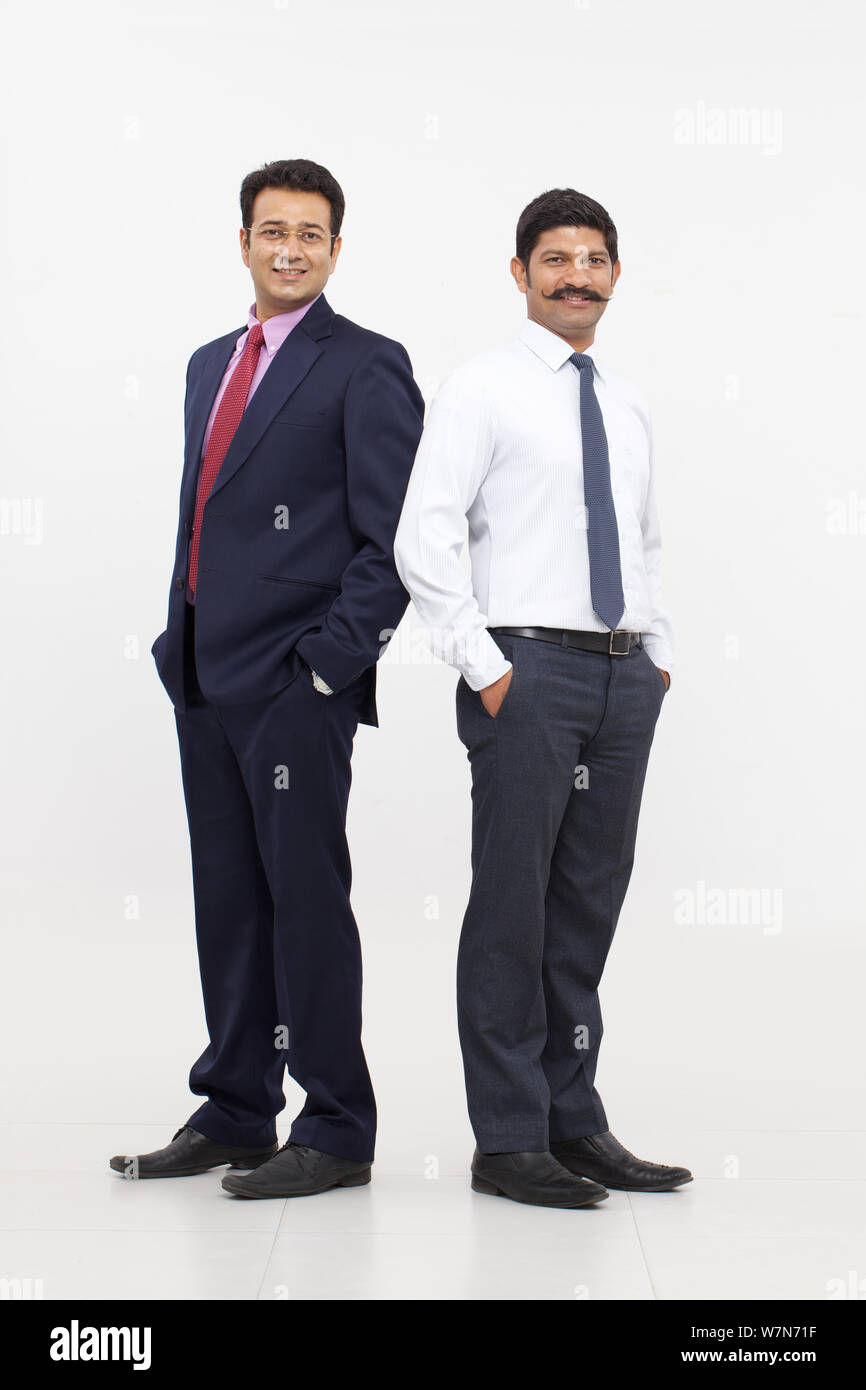 Two business executives standing together Stock Photo - Alamy