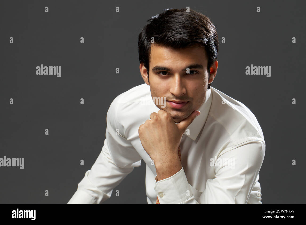 Hand on chin businessman hi-res stock photography and images - Alamy