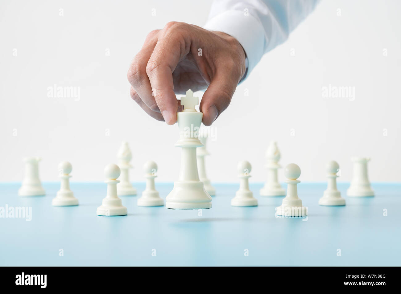 Hand holding chess piece hi-res stock photography and images - Alamy