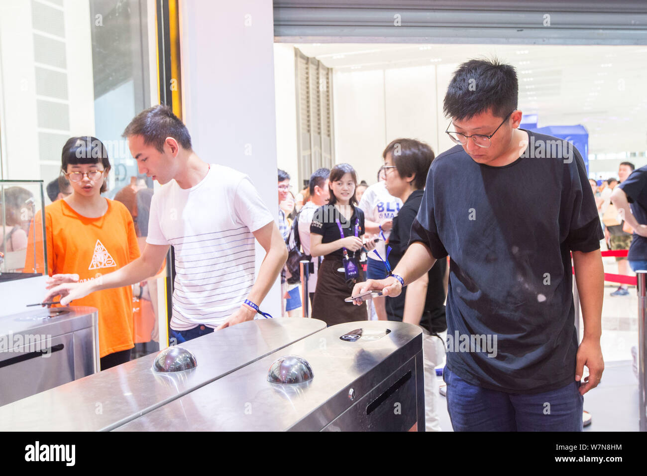 Customers scan the QR codes to get electronic entrance tickets of the ...