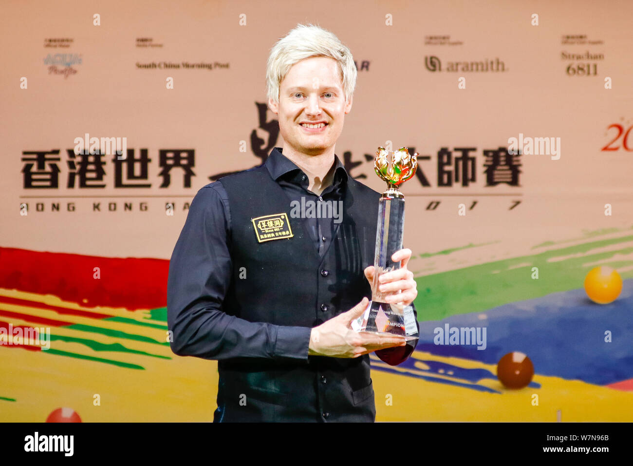 Neil Robertson of Australia poses with his trophy during the award ...