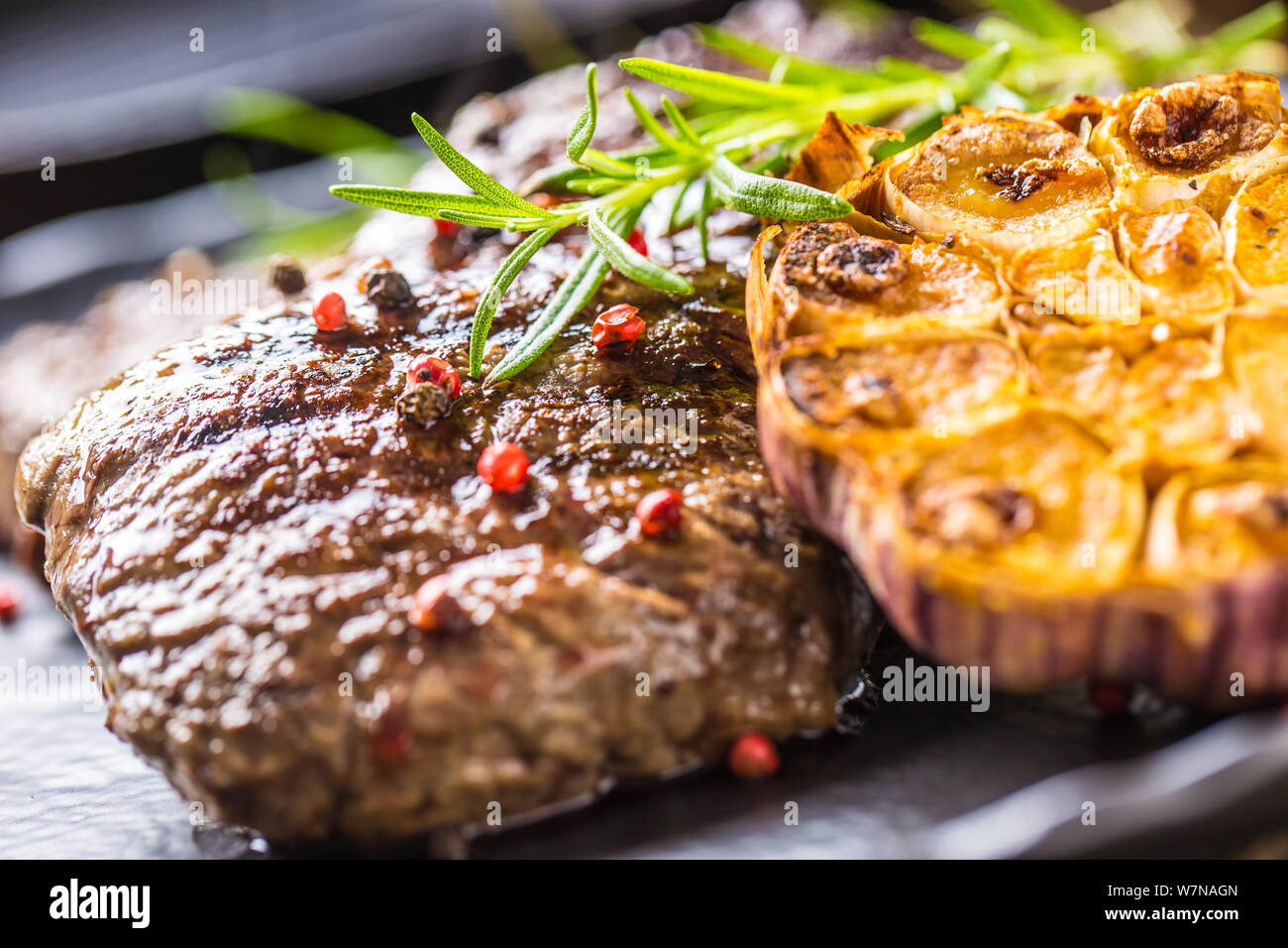 Grilled beef Rib Eye steak with garlic rosemary salt and spices Stock ...