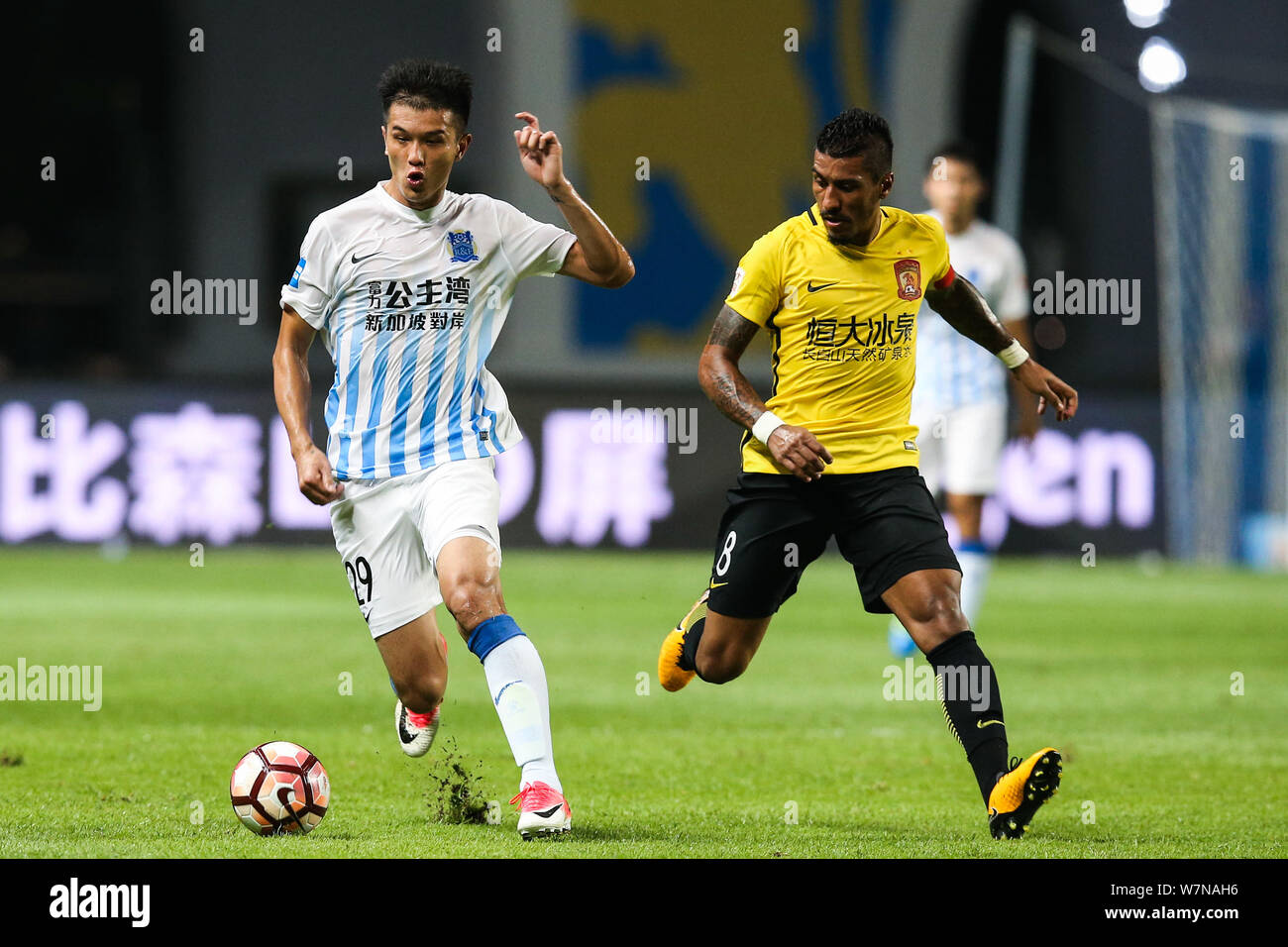 Brazilian football player Paulinho, right, of Guangzhou Evergrande ...