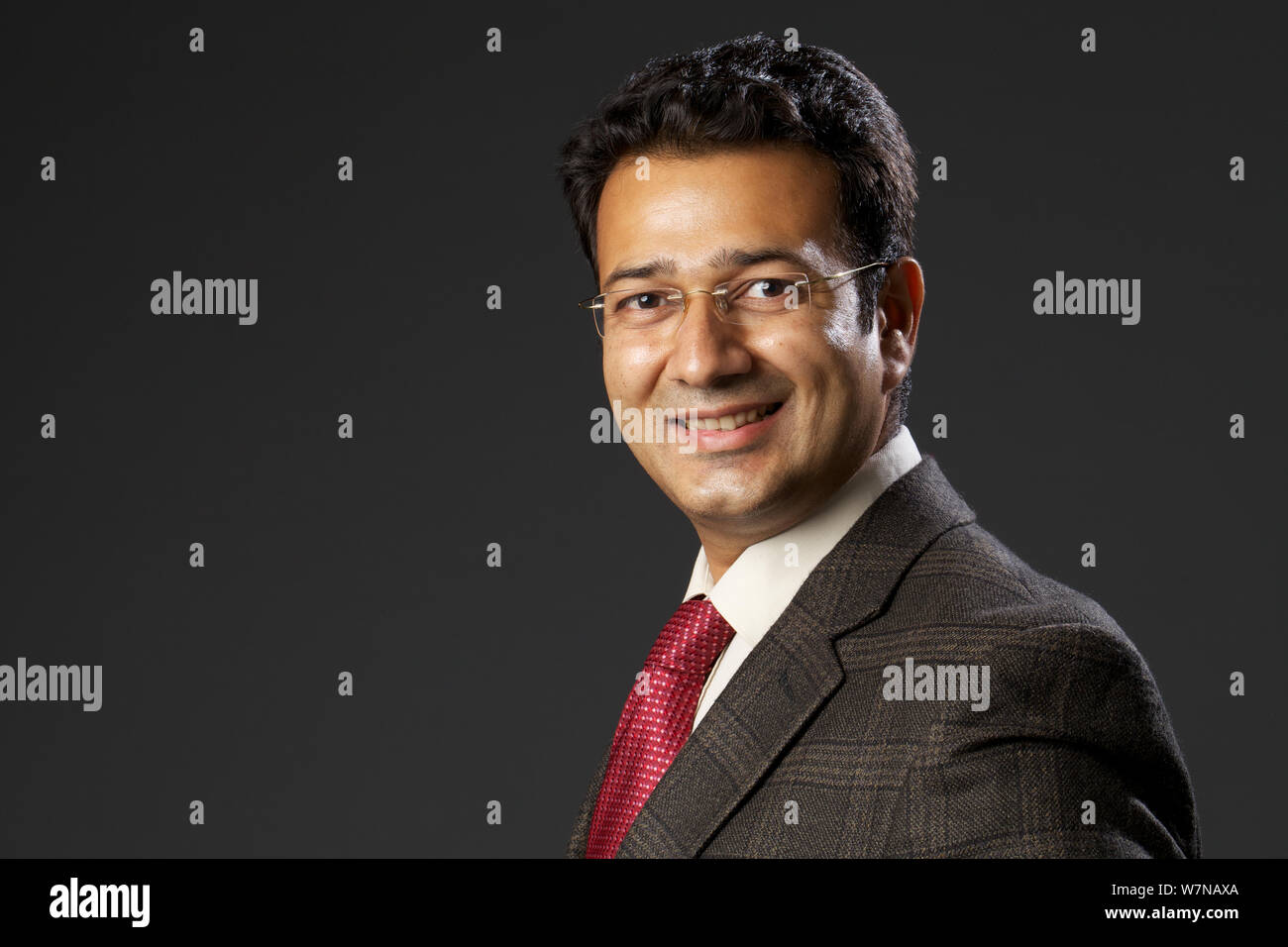 Side profile of a businessman smiling Stock Photo - Alamy