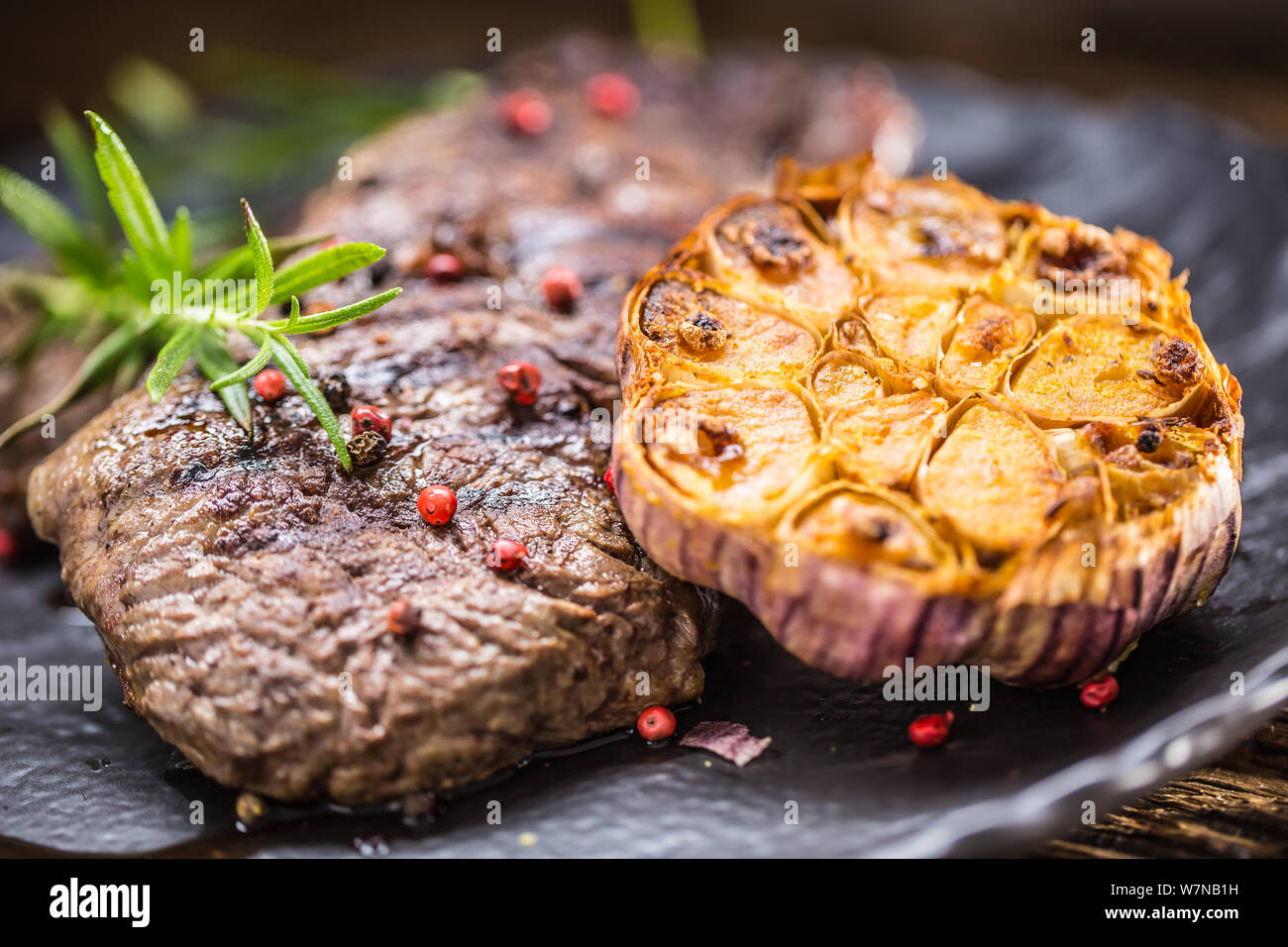 Grilled beef Rib Eye steak with garlic rosemary salt and spices Stock ...