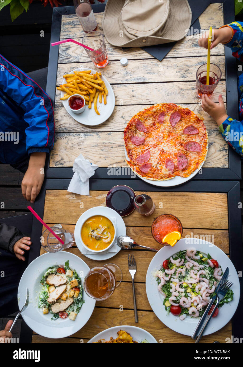 Top view family, adult and children, dinner concept, on wooden table ...