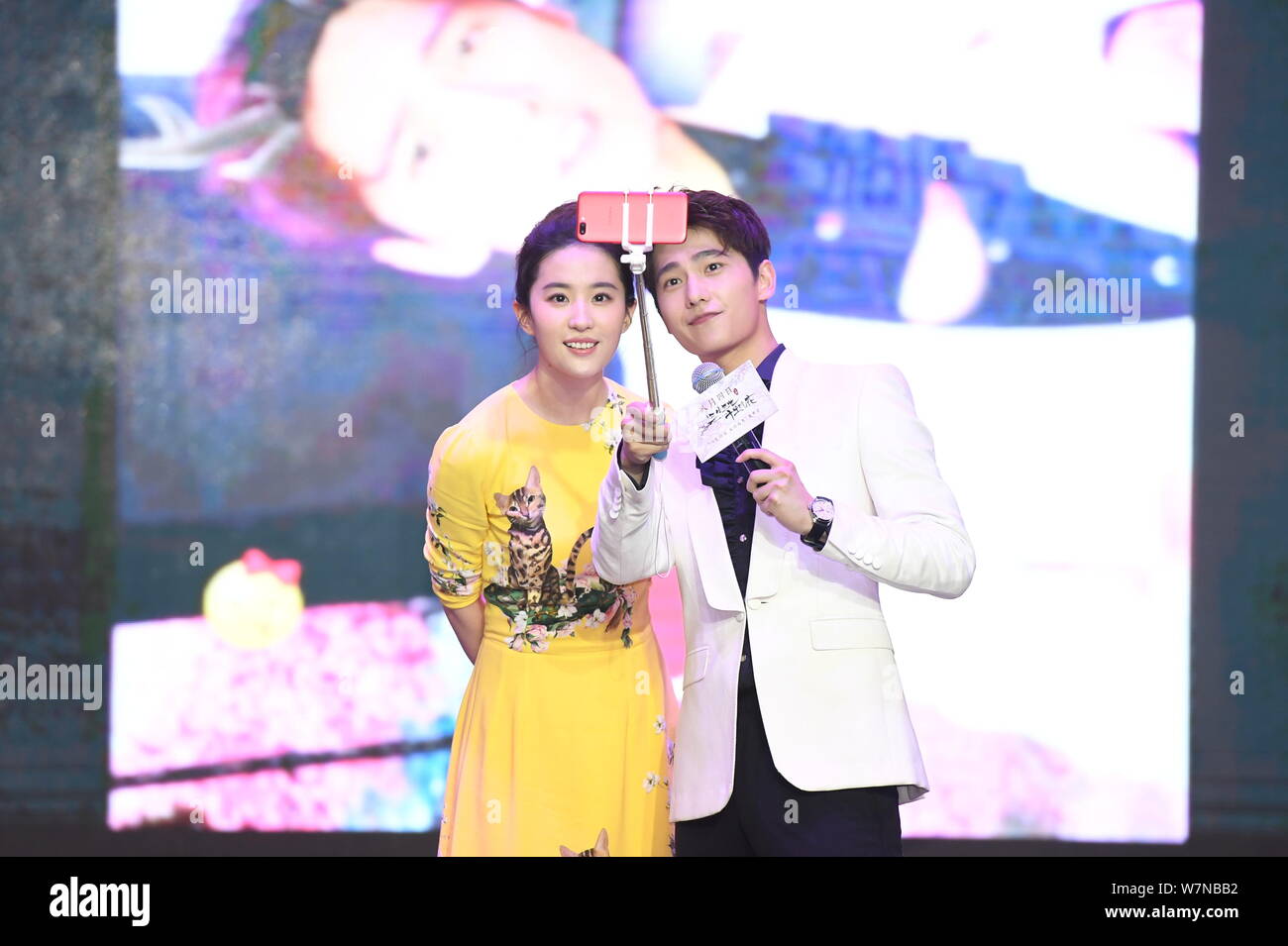 Chinese actress Liu Yifei, left, and actor Yang Yang take a selfie ...