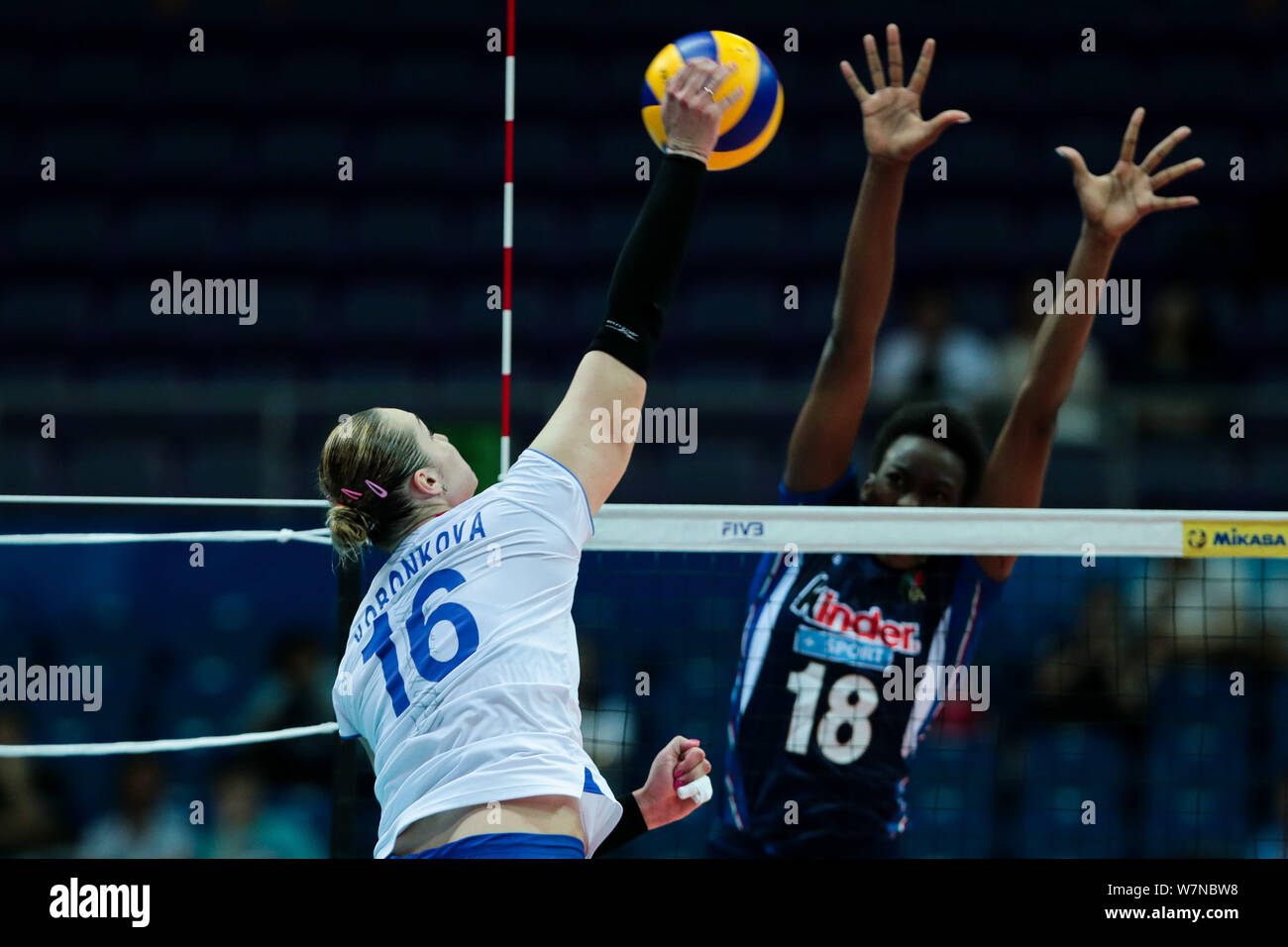 Irina Voronkova, front, of Russia spikes against Paola Ogechi Egonu of ...