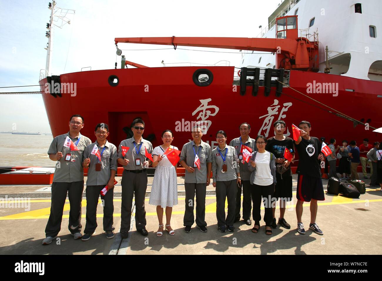 Chinese scientists pose in front of the icebreaker Xuelong, or Snow ...