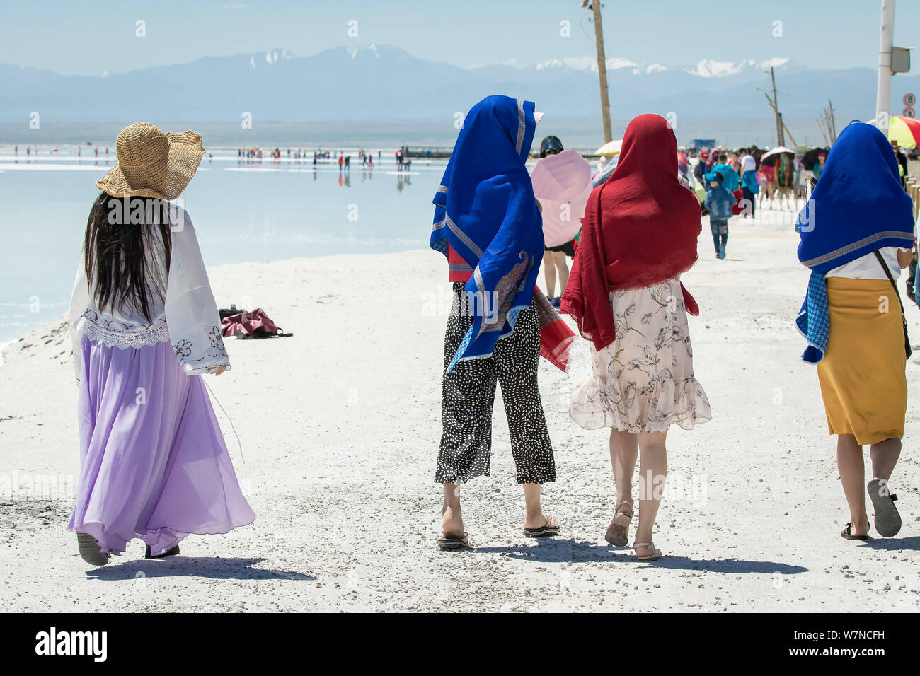 Tourists are pictured as they visit the Chaka Salt Lake in Ulan county ...