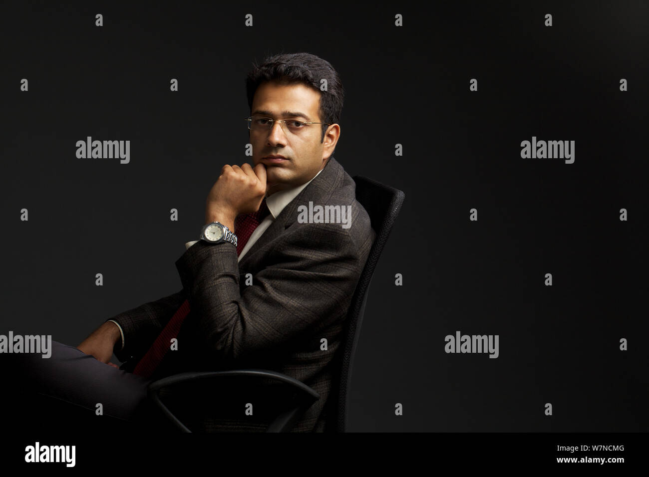 Indian businessman serious chair hi-res stock photography and images ...