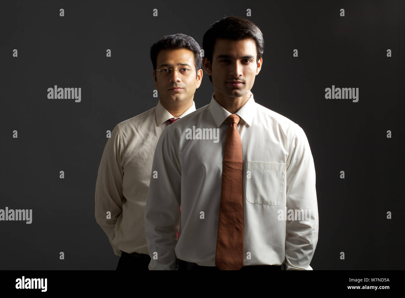 Two business executives standing Stock Photo - Alamy
