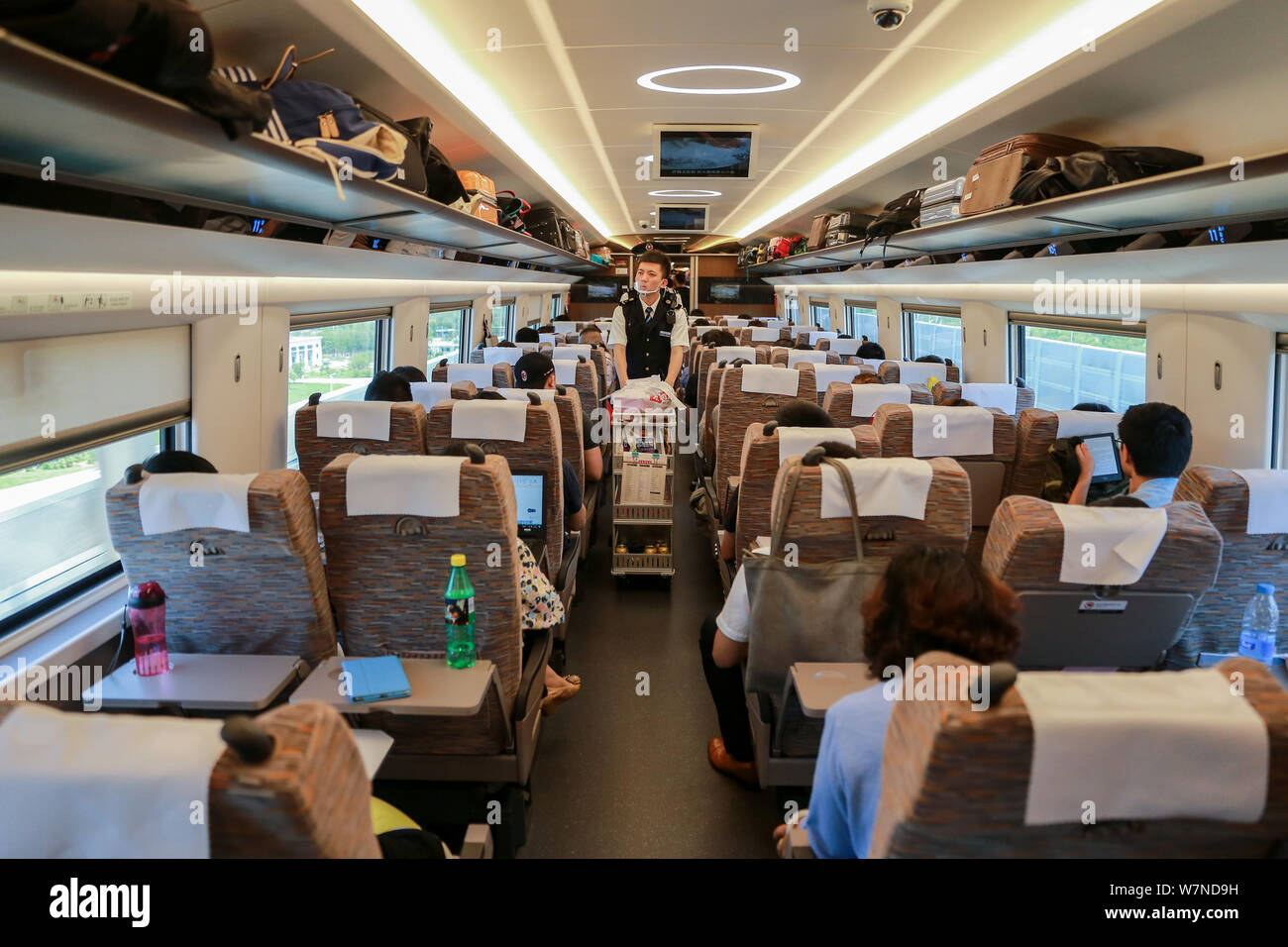 Railway staff deliver the meal to the seat designated by the passenger ...