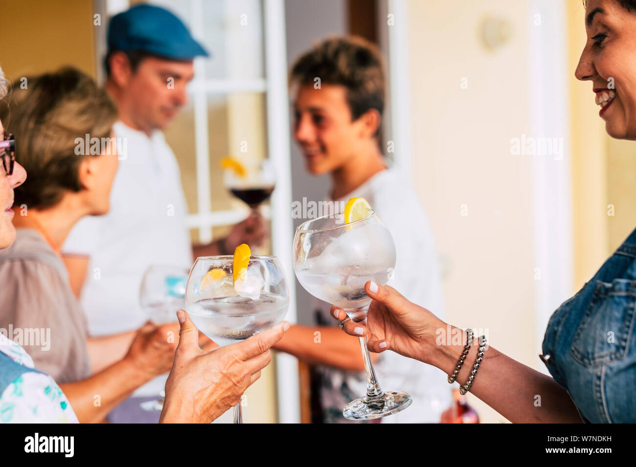 People toasting with glass and cocktails together in friendship ...