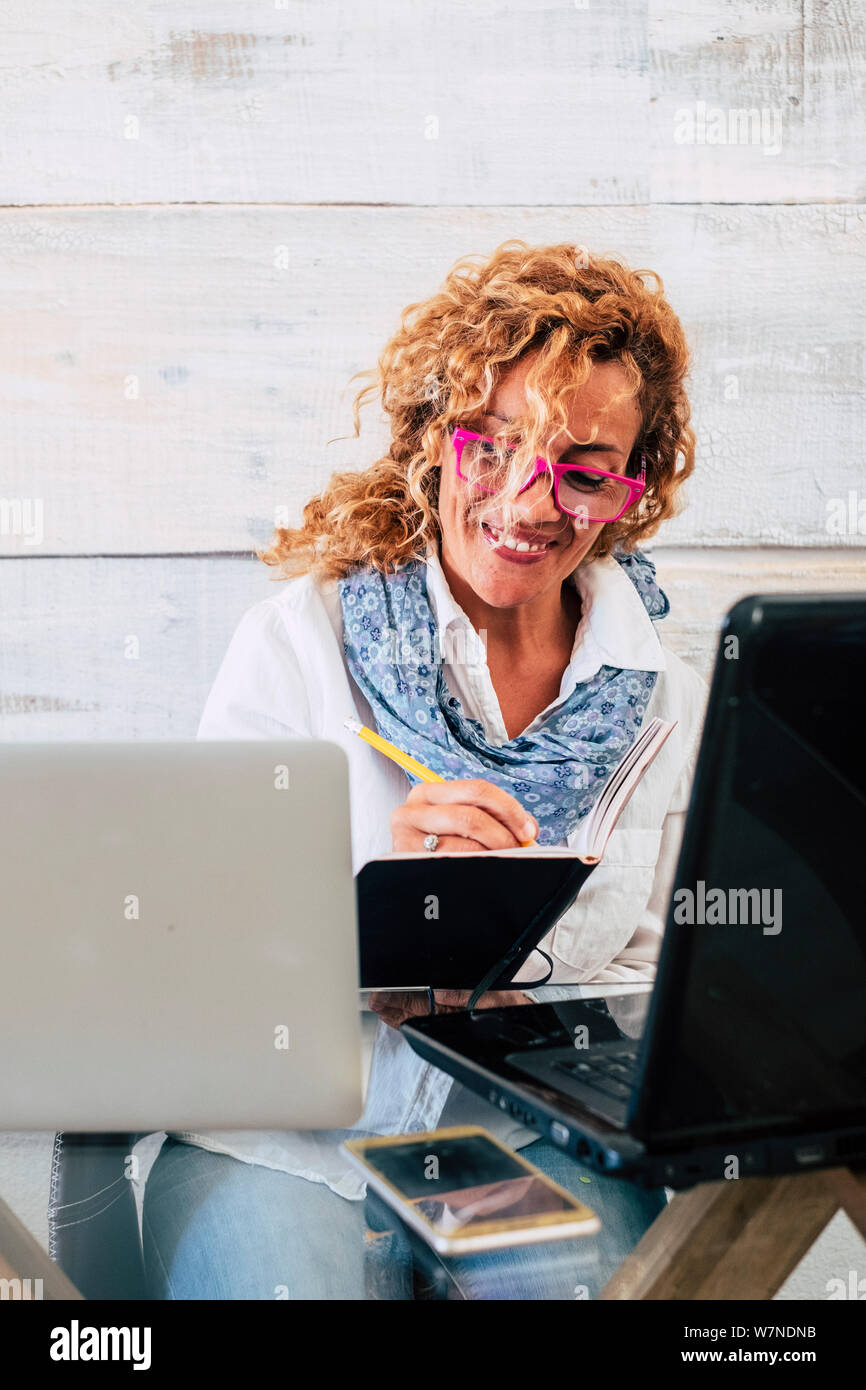 Happy cheerful people at work with technology computers in double ...