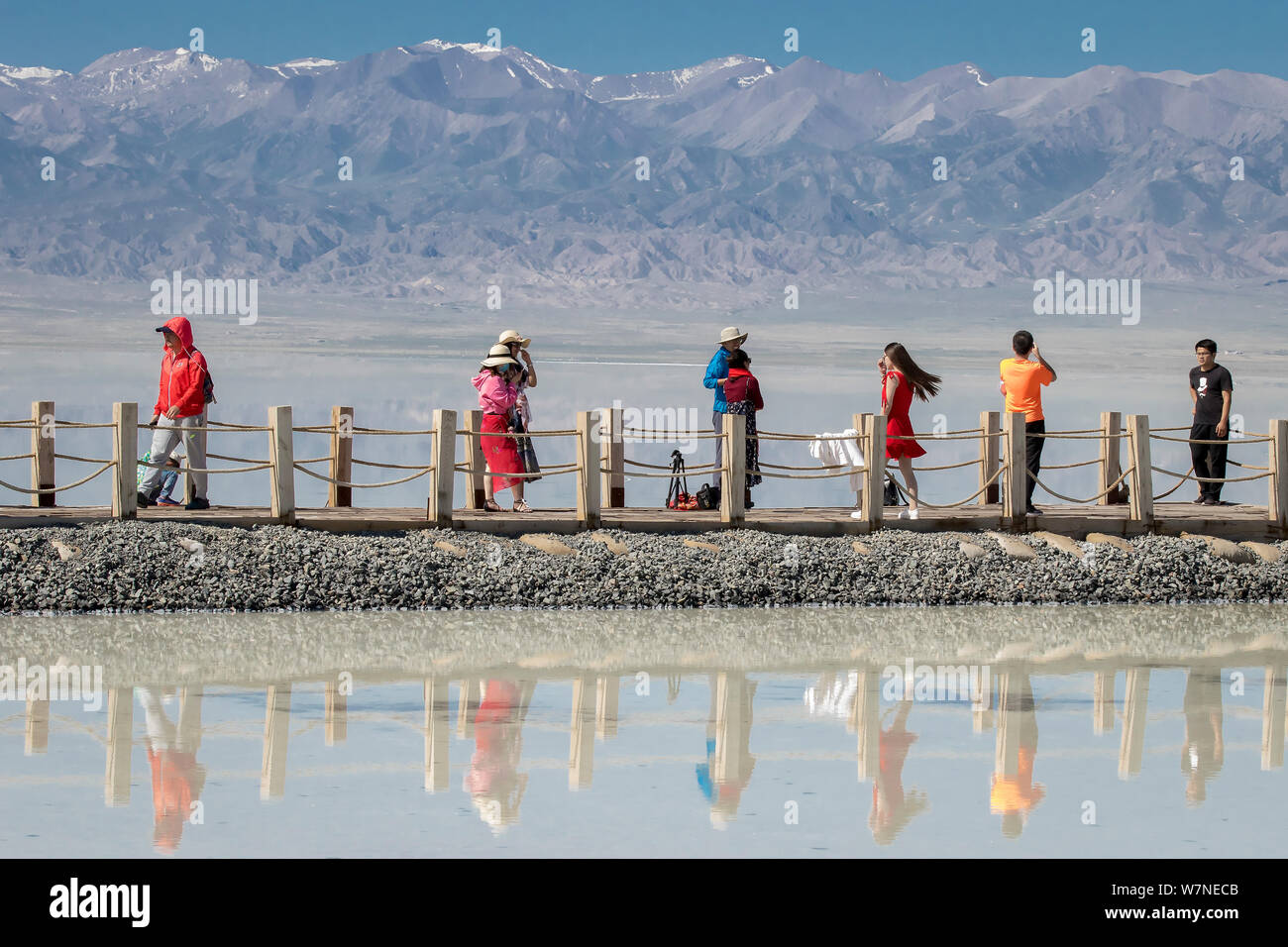 Tourists are pictured as they visit the Chaka Salt Lake in Ulan county ...
