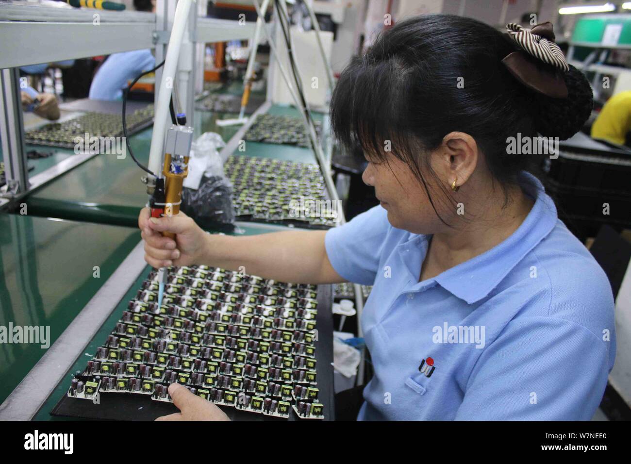 Female factory worker produces hi-res stock photography and images - Alamy