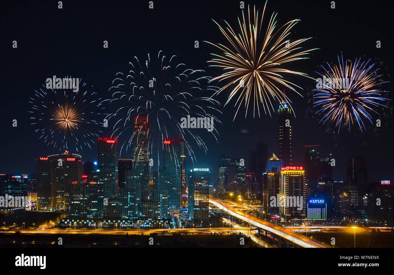 --FILE--Fireworks explode over skyscrapers and high-rise office ...