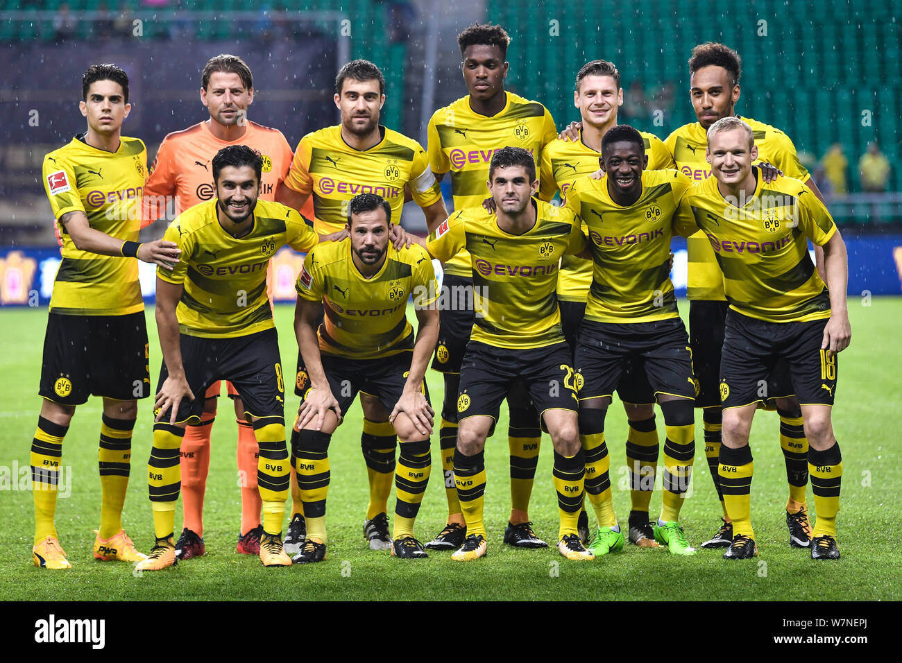 Players of the starting line-up of Borussia Dortmund pose before ...