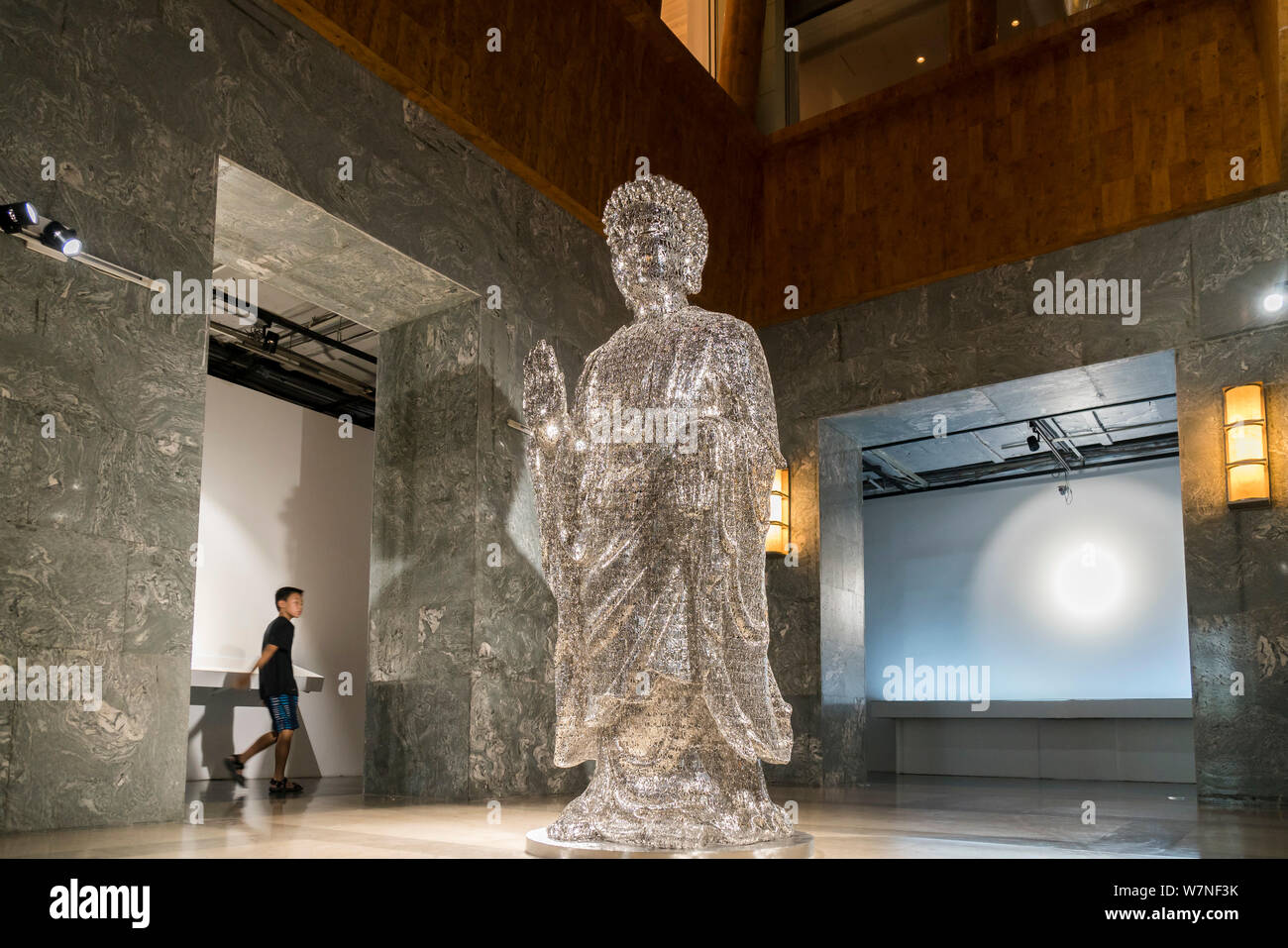 An artwork in the form of a Buddharupa named "Wenyu" is on display at ...